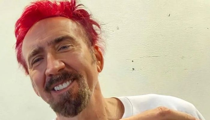 Nicolas Cage fires up in new bright red hair