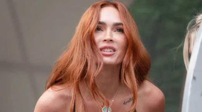 Megan Fox shows off Machine Gun Kelly TATTOO at his Germany Show