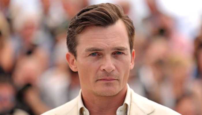Rupert Friend lands the cast of New Line’s Sci-Fi Thriller ‘Companion’