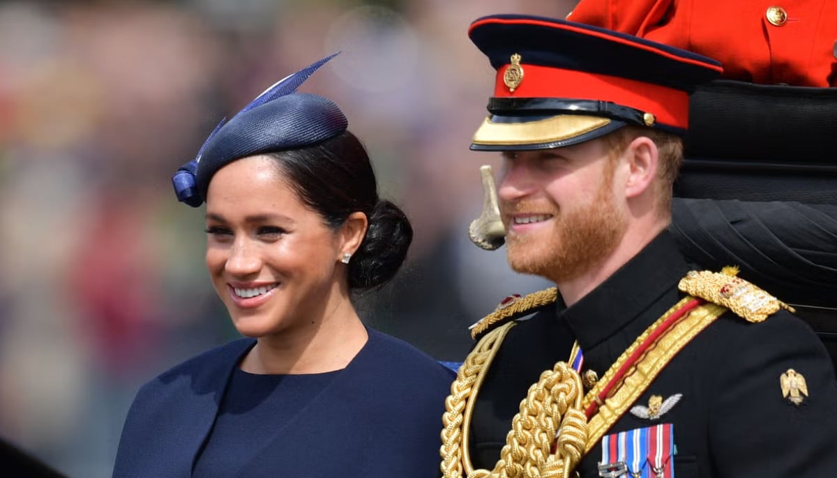 Prince Harry's harsh exchange with Meghan Markle on Palace balcony divides fans